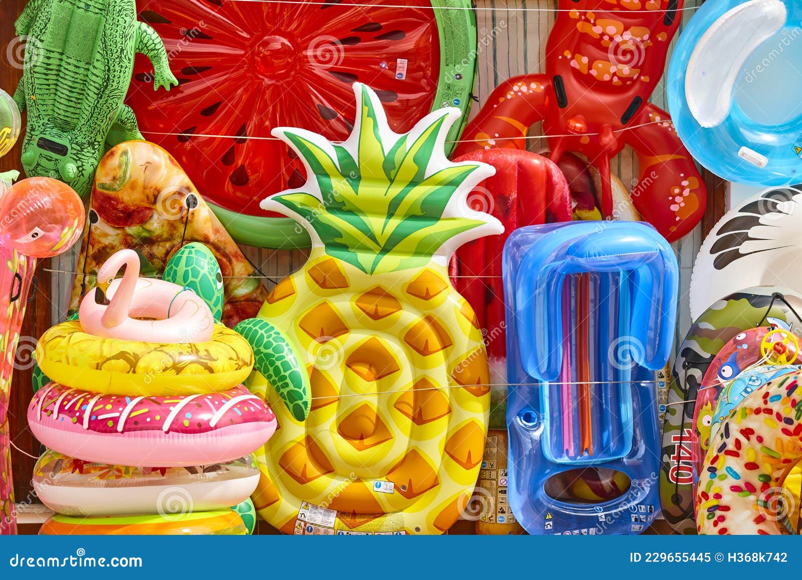 Several Colorful Plastic Beach Floaters. Summer Holiday Fun Time Stock ...