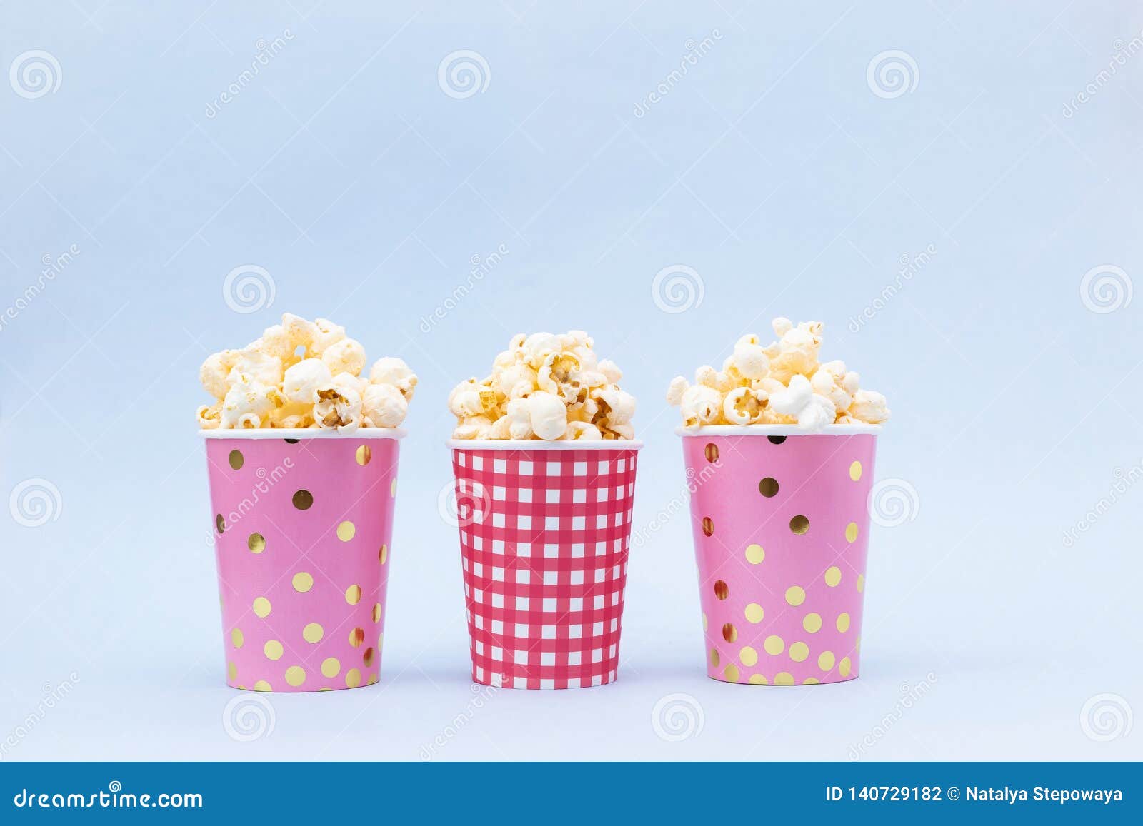 Several Cups of Popcorn on a Blue Background Stock Photo - Image of ...