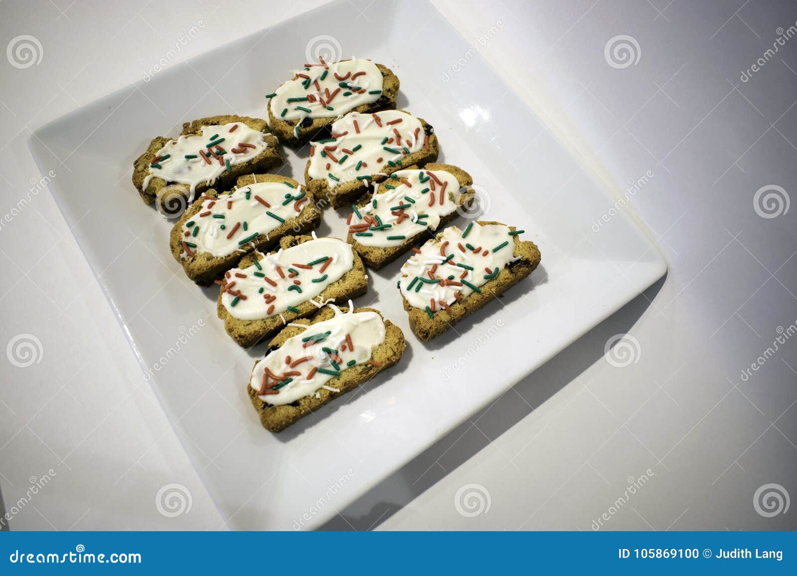 Several Decorated Cookies on a Square White Plate. Stock Photo - Image ...