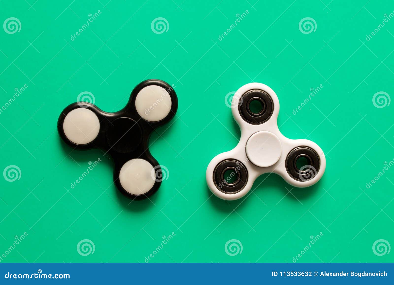 Several Different Fidget Spinners . Isolated on Blue Background Stock ...