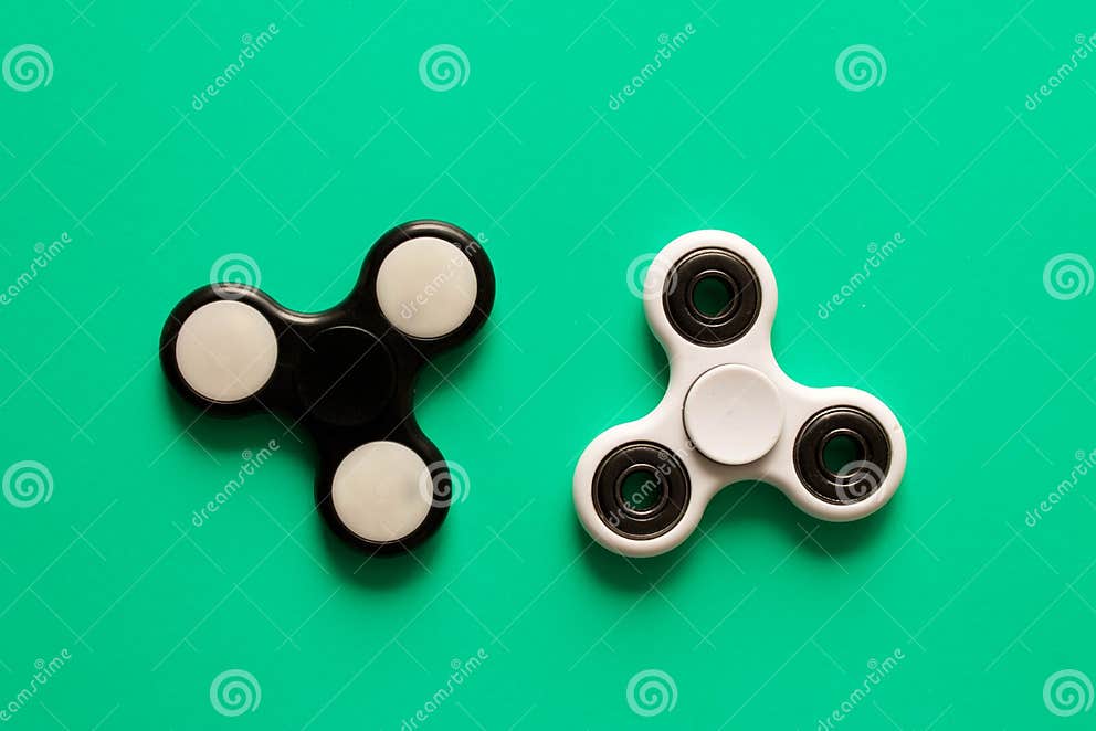 Several Different Fidget Spinners . Isolated on Blue Background Stock ...
