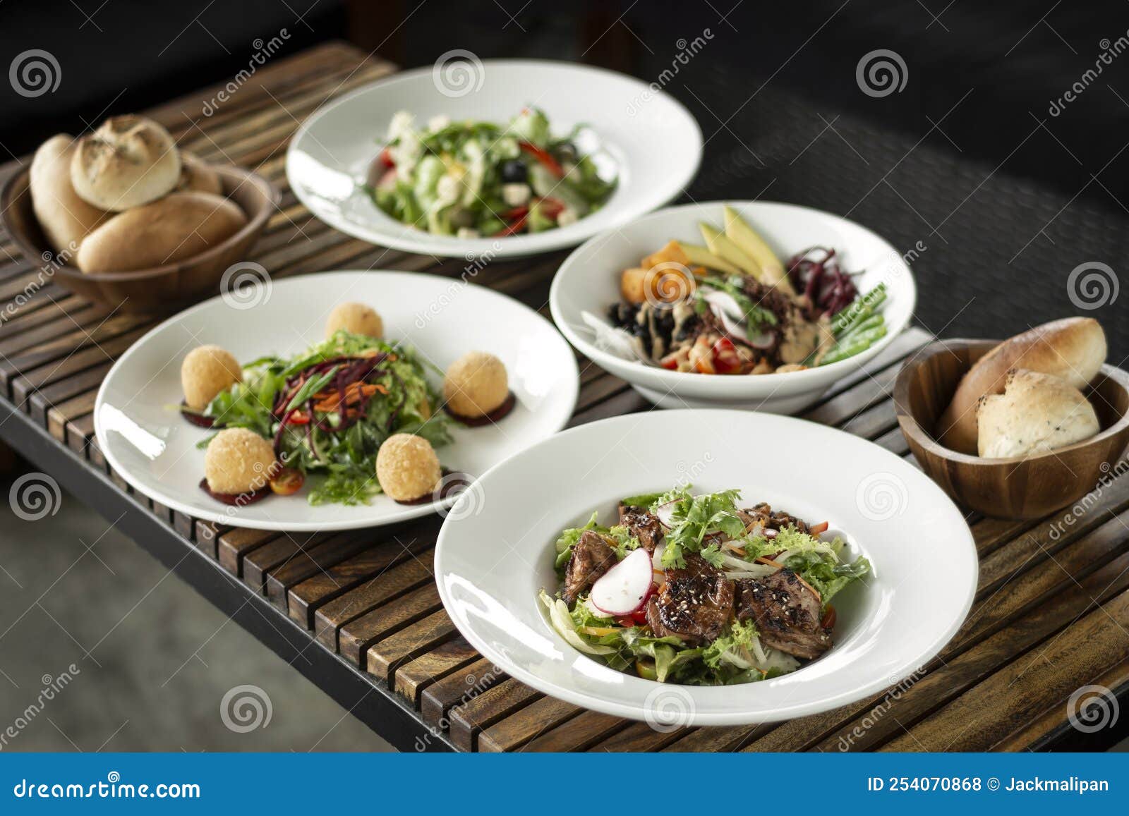 Several Different Fresh Salad Dishes on Restaurant Table Stock Photo ...