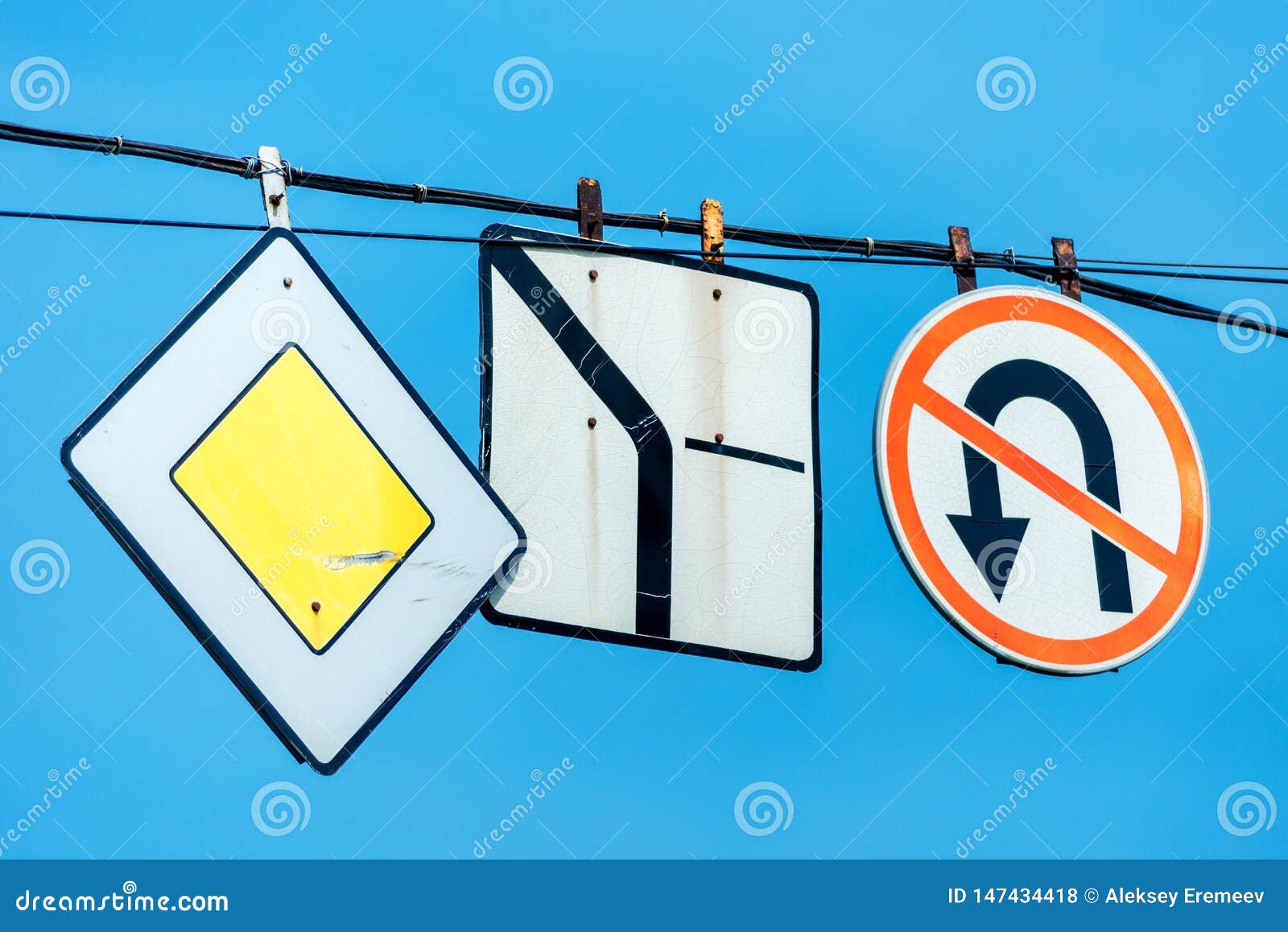 Several Different Road Signs Hanging Against the Sky Stock Photo ...