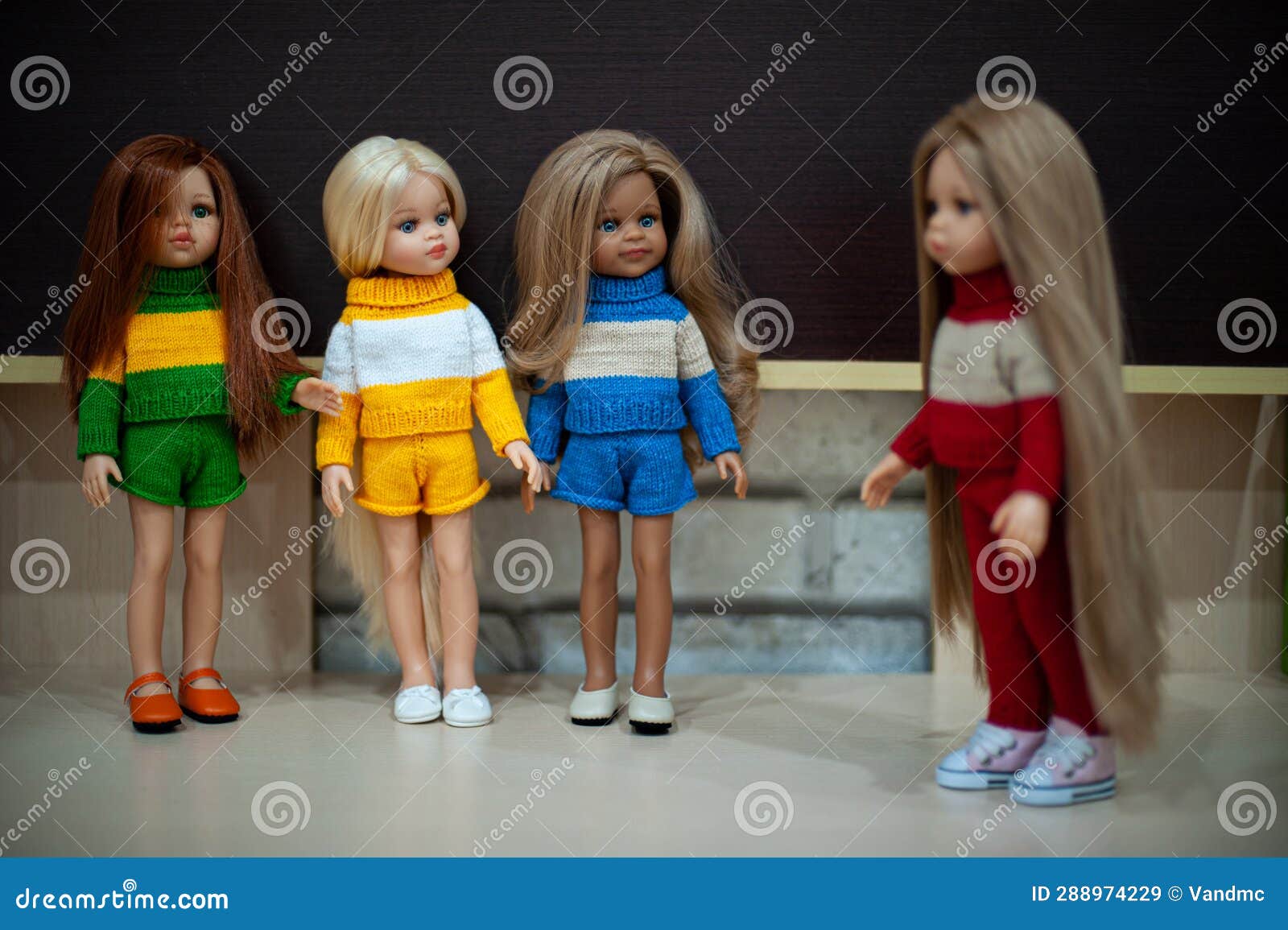 Several Dolls of Different Appearance are Standing Next To Each Other ...