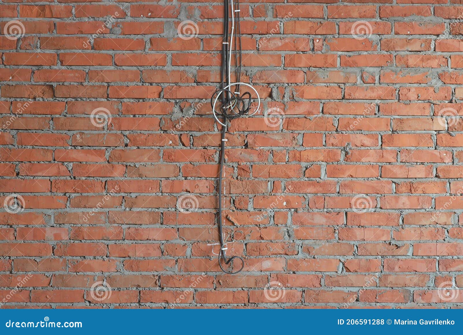 Several Electrical Cables on a Brick Wall for the Installation of ...