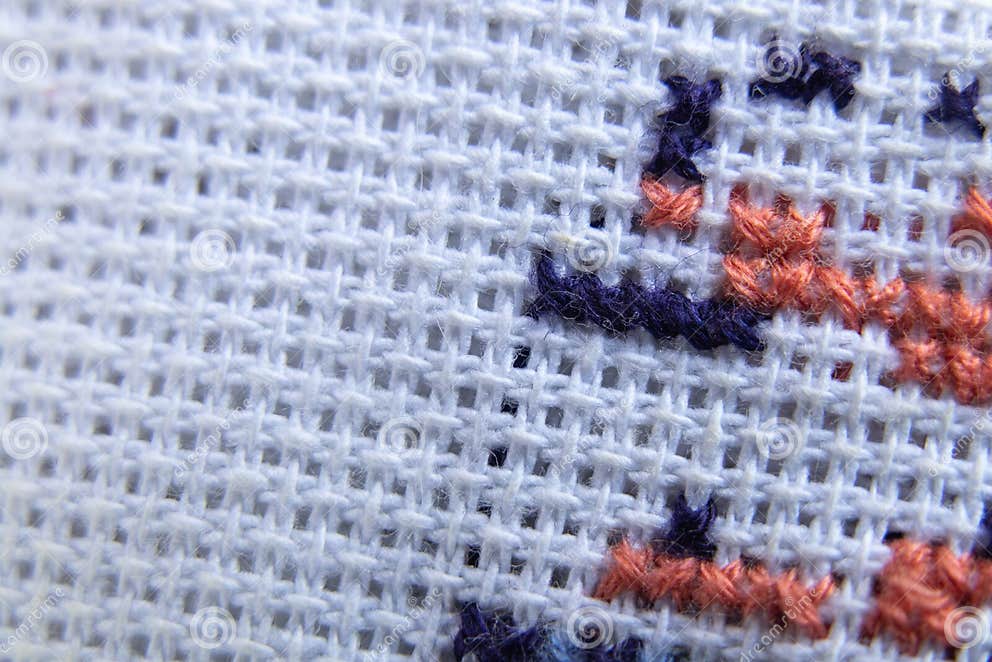 Several Embroidered Stitches with Multi-colored Thread on a White ...