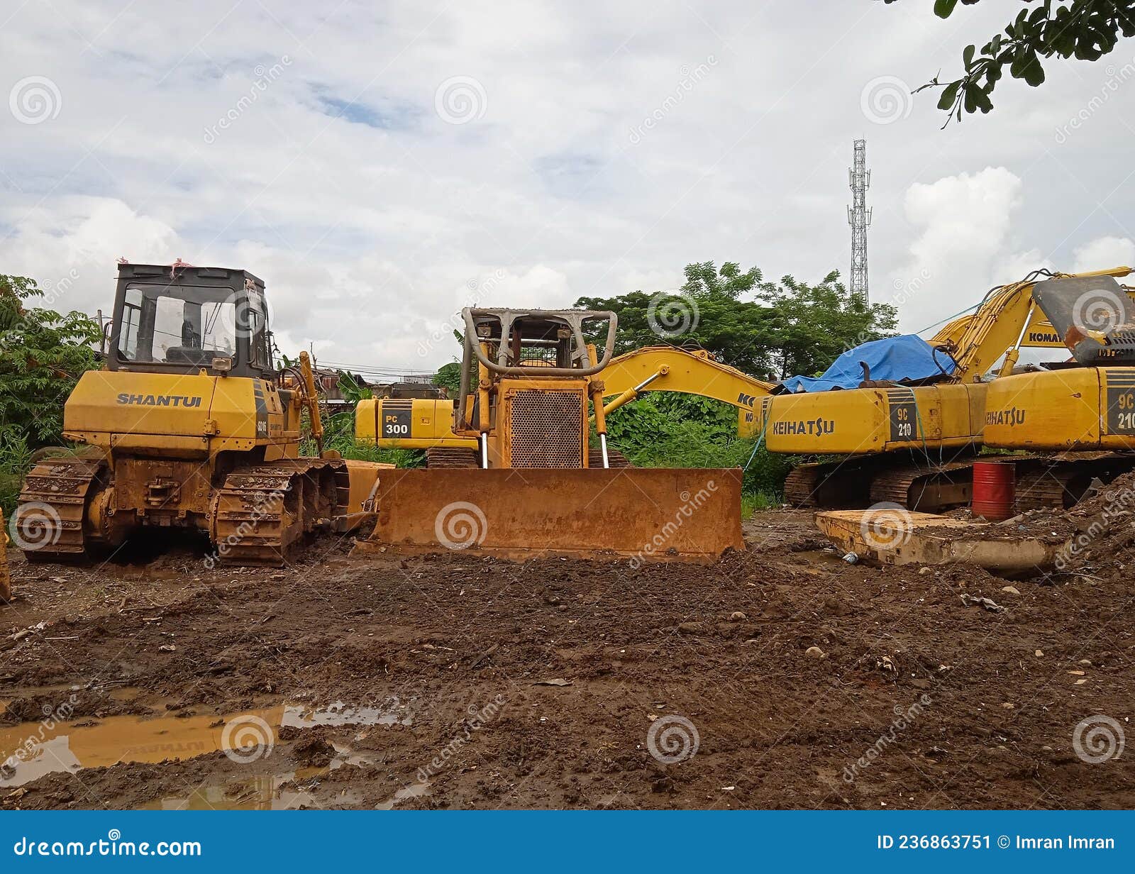 Several Excavators on Display at the Roadside of the Racing Center ...