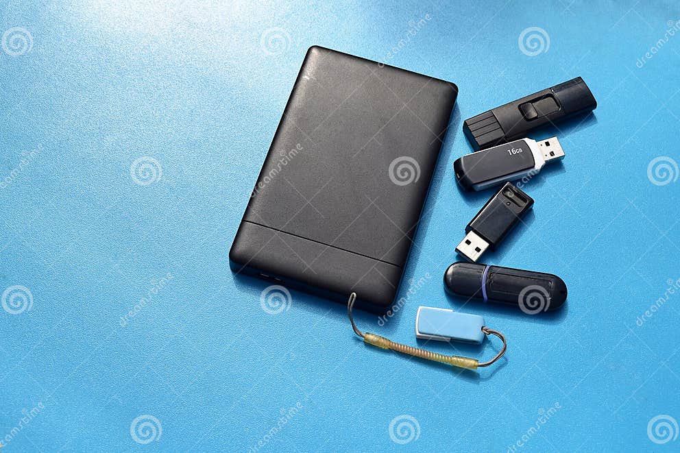 Several Flash Drives of Different Sizes on a Blue Background Stock ...