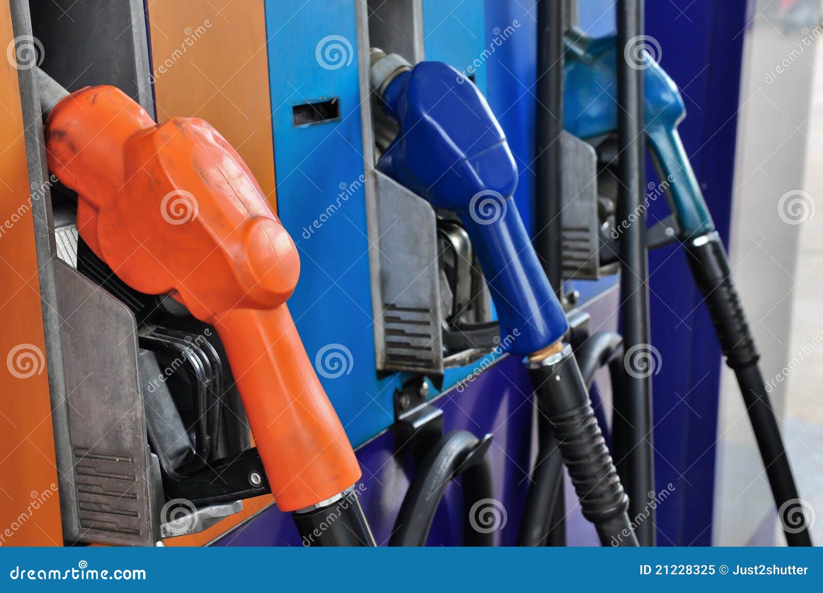 Several Gasoline Pump Nozzles at Petrol Station Stock Image - Image of ...