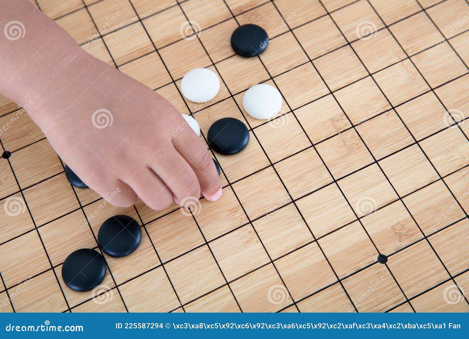 Several Go Chess Pieces Scattered on the Go Board Stock Photo - Image ...