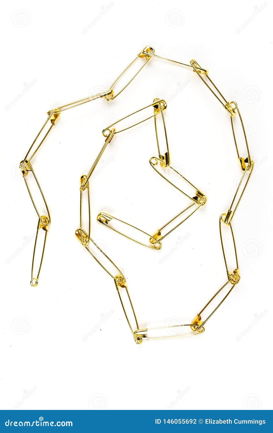 Several Gold Safety Pins Chained Stock Photo - Image of shiny, natural ...