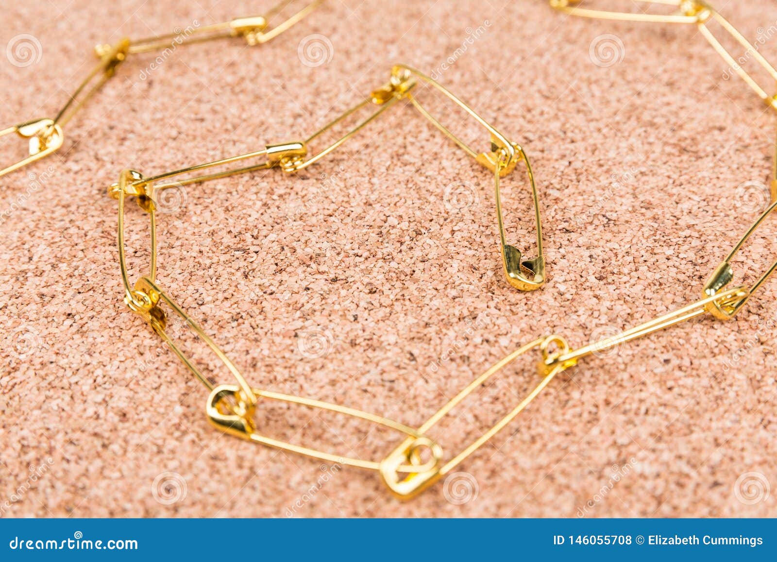 Several Gold Safety Pins Chained Stock Photo - Image of shiny ...