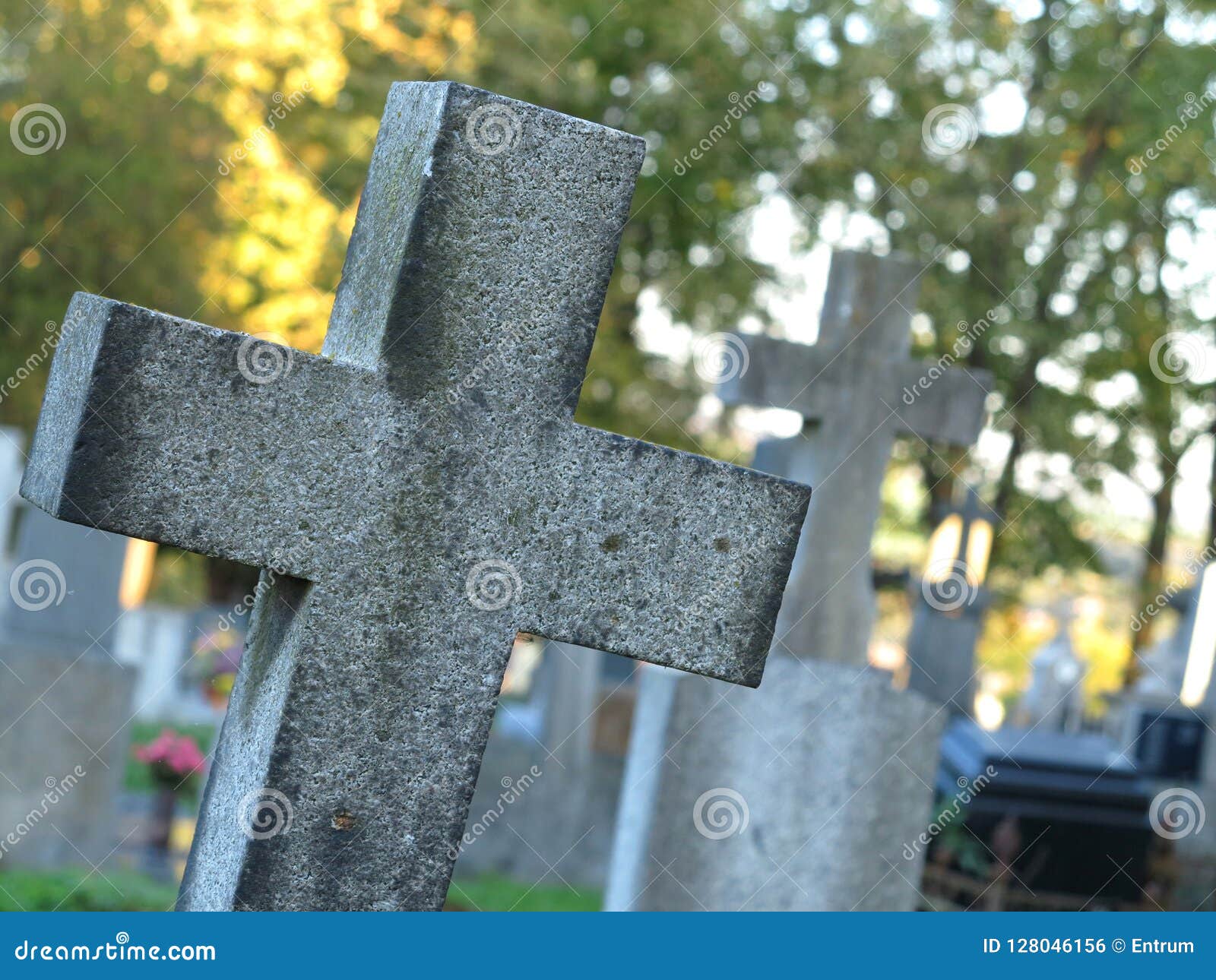 Cemetery At Sunset, With The Sun Setting Behind A Row Of Headstones ...