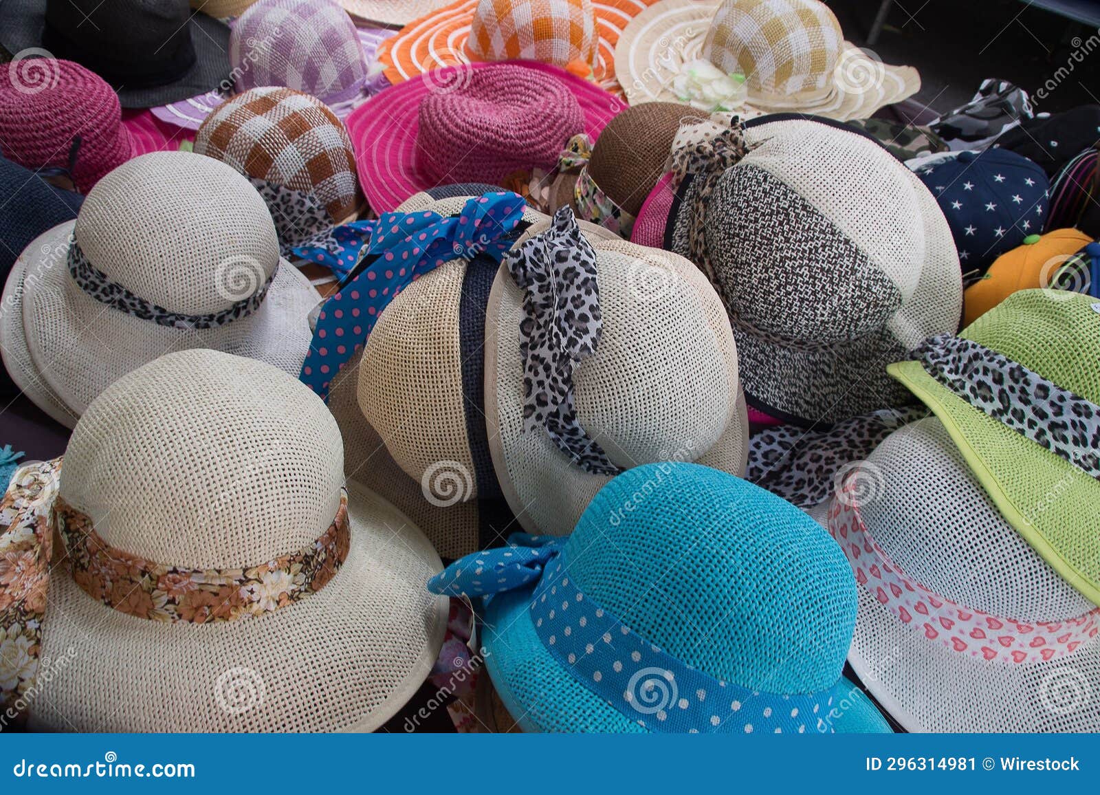 Several Hats with Colorful Patterns and Bows in Rows on Display Stock ...