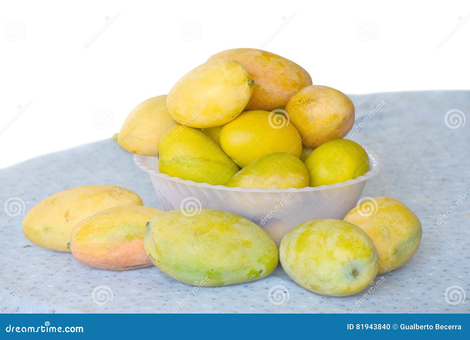 Several Juicy Mangoes in a Tray Over a Table on a White Background ...