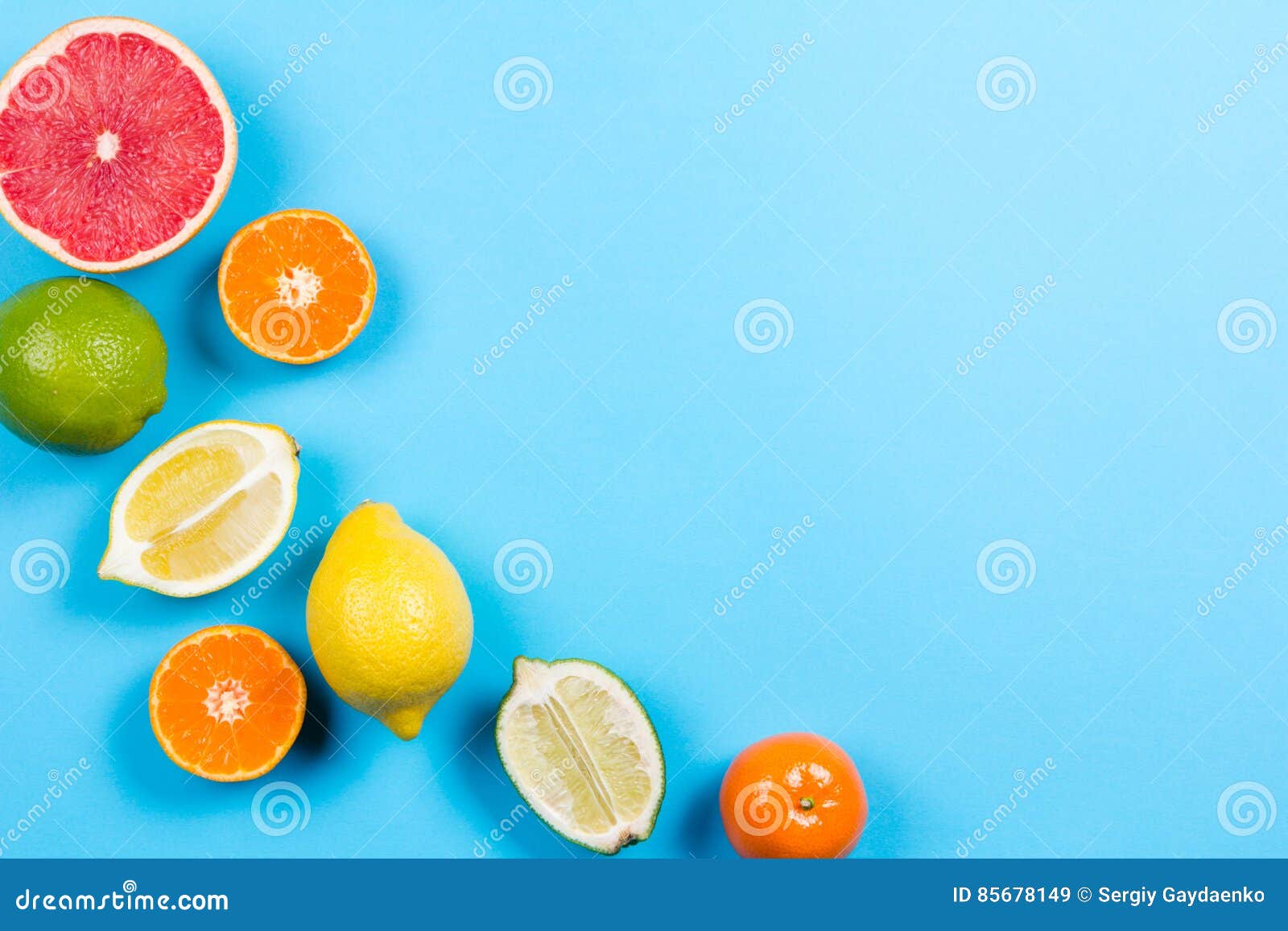 Several Kinds of Whole and Cut Citrus on a Blue Background Stock Image ...