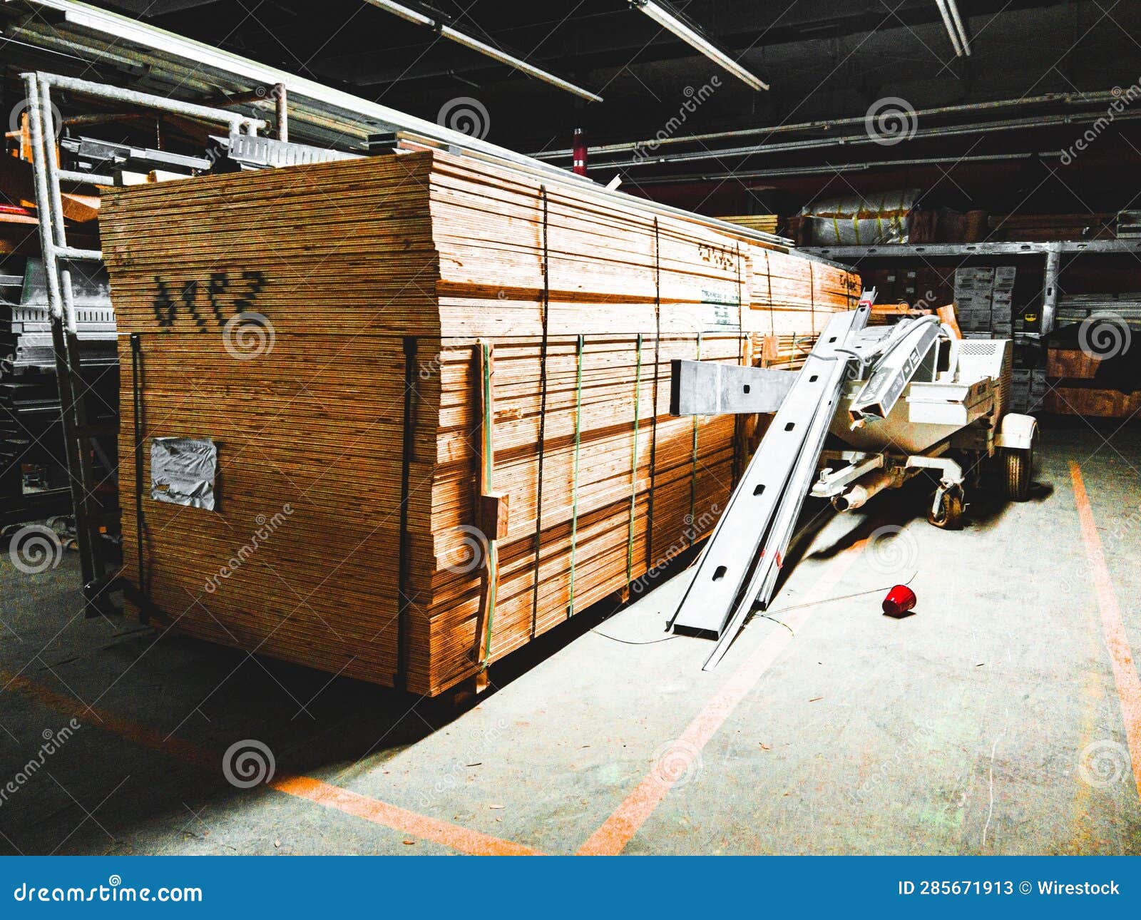 Several Large Stacks of Lumber in an Warehouse with Lots of Wood ...