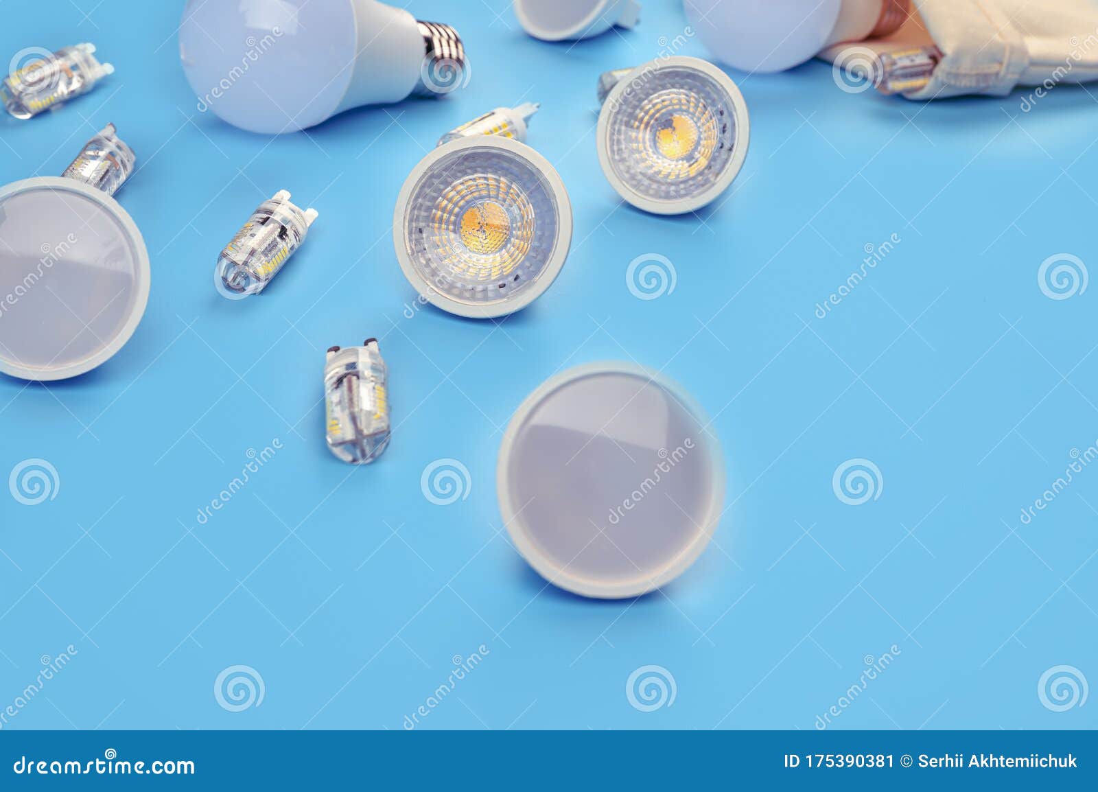 Several LED Bulb on Blue Background. Saving Energy Concept. Ftat Lay ...