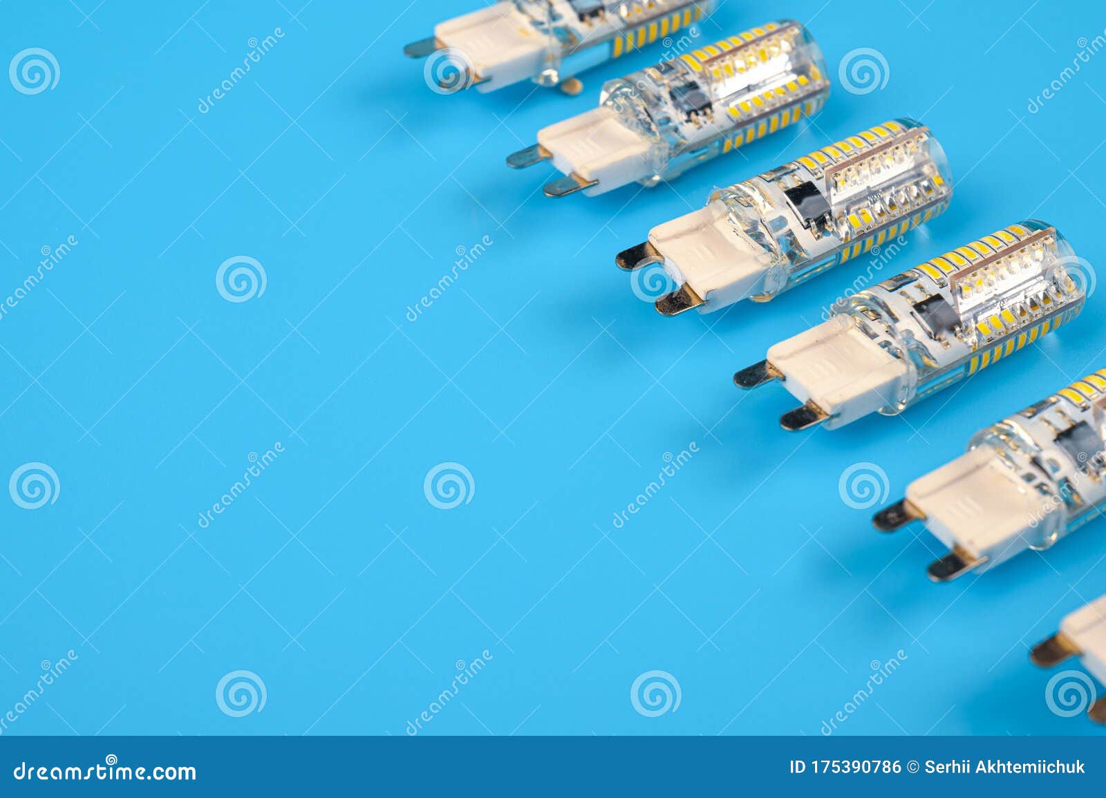 Several LED Bulb on Blue Background. Saving Energy Concept. Ftat Lay ...