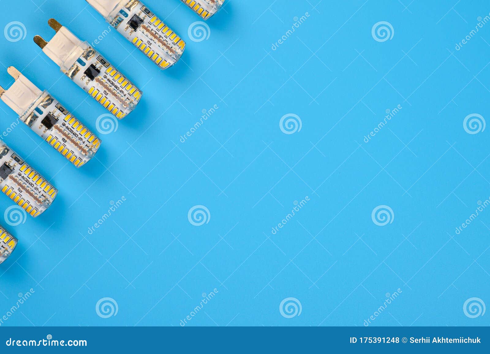 Several LED Bulb on Blue Background. Saving Energy Concept. Ftat Lay ...