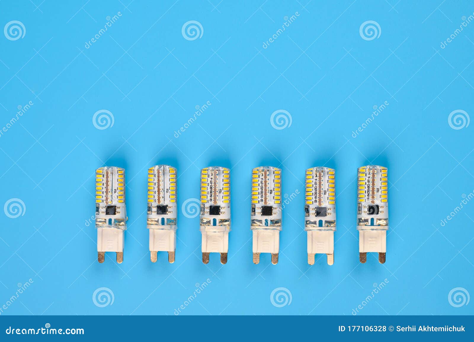 Several LED Bulb on Blue Background. Saving Energy Concept. Ftat Lay ...