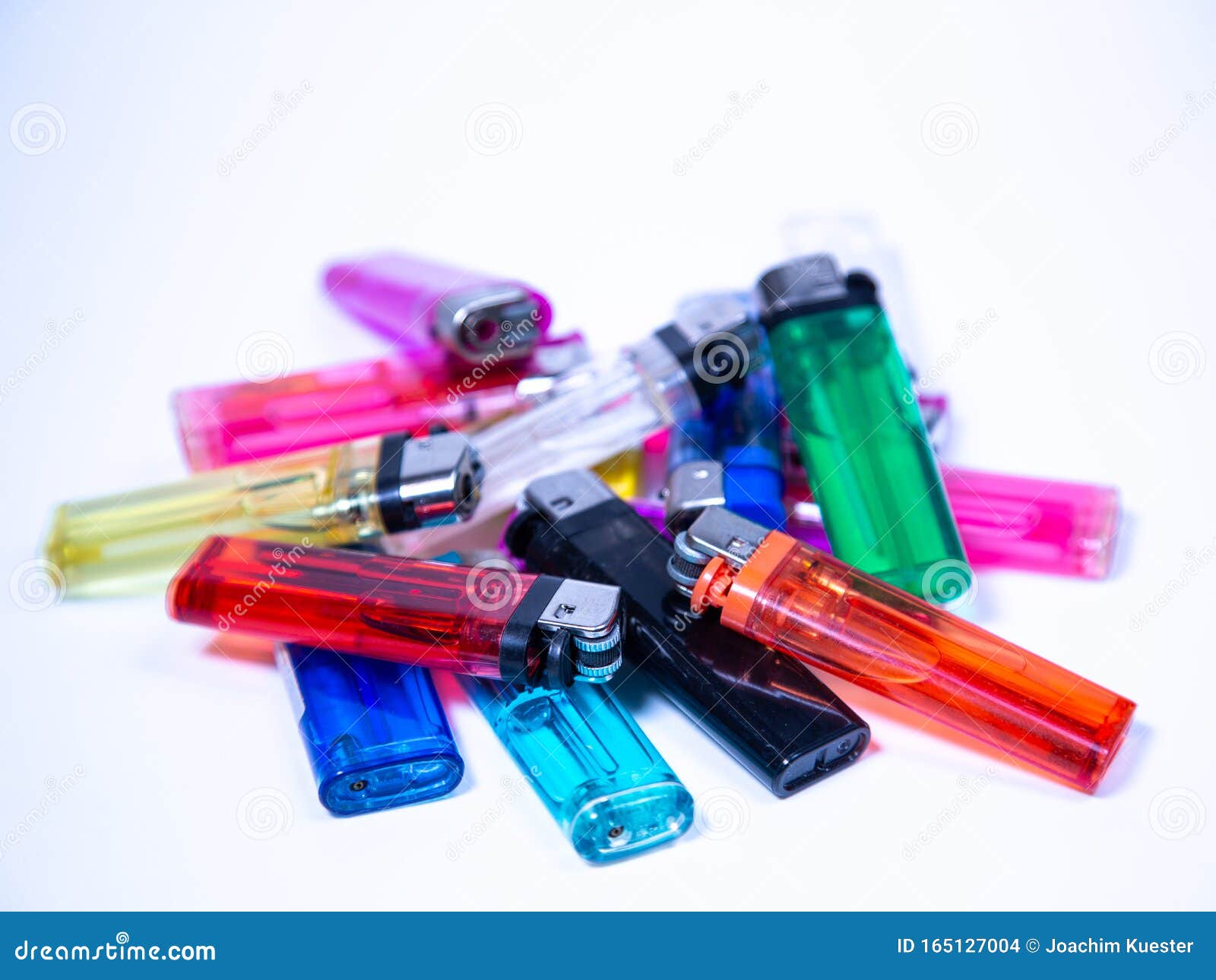 Several Lighters in Different Colors Lying Mixed Up with Focus on the ...