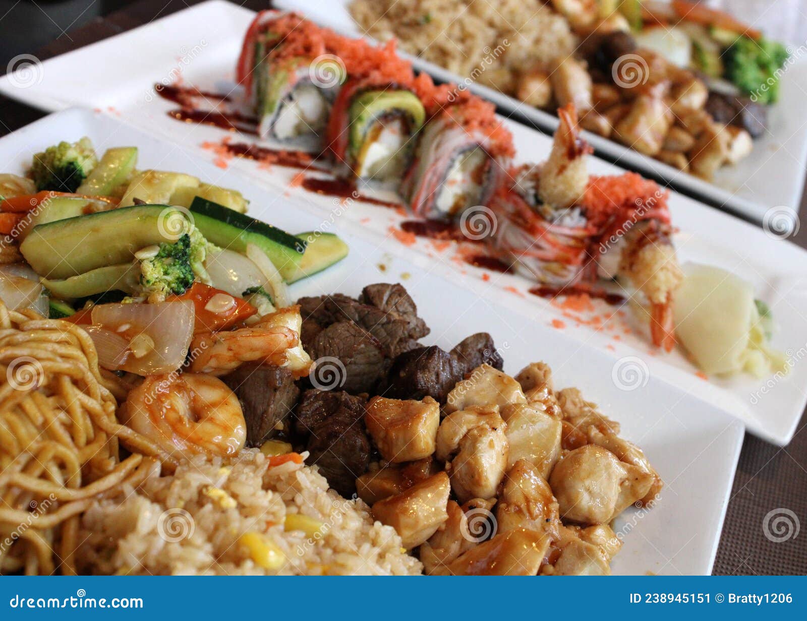 Several Long White Plates Covered with Assortment of Sushi Options for ...