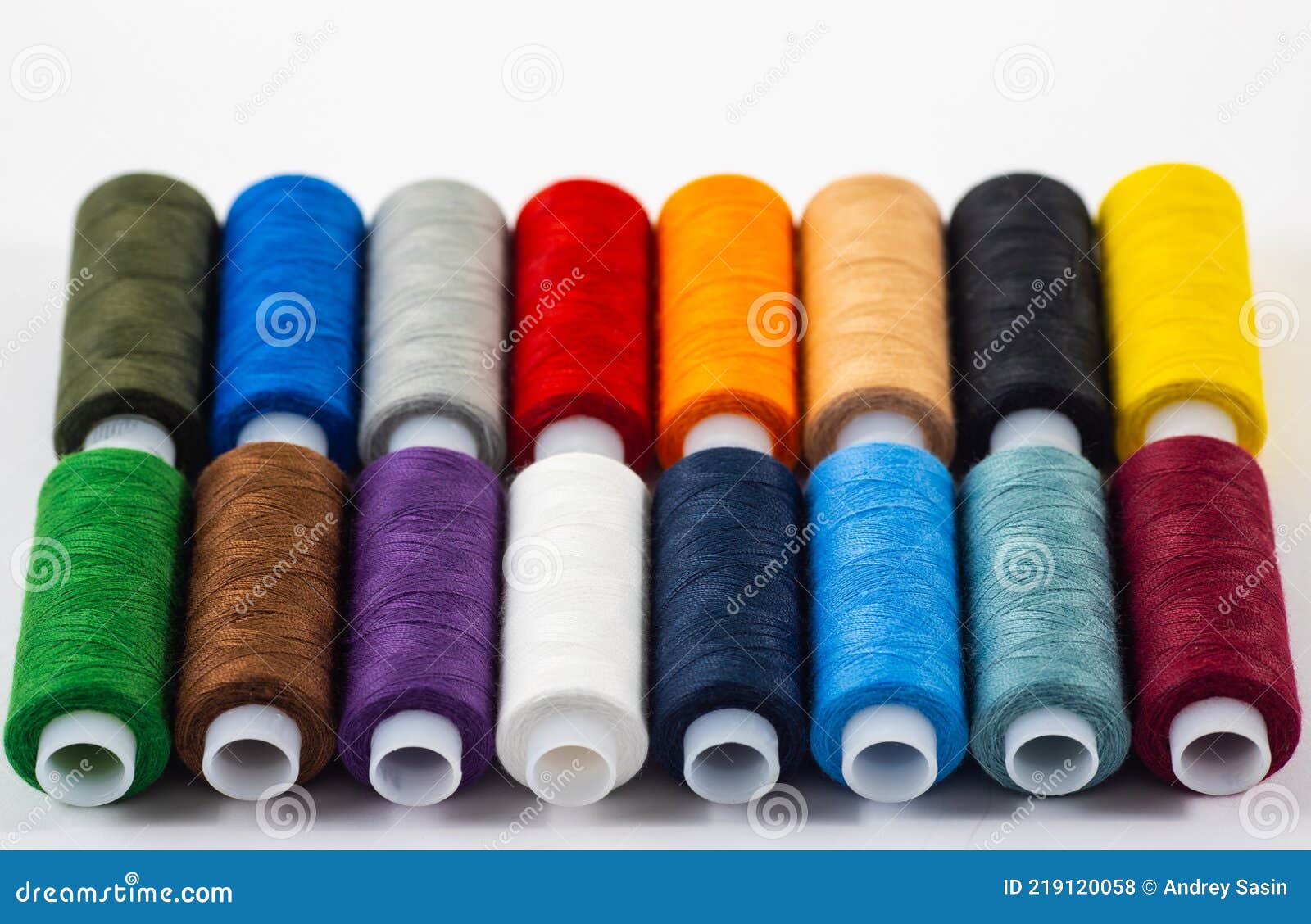 Several Multi-colored Bobbins with Thread Isolated on White Background ...