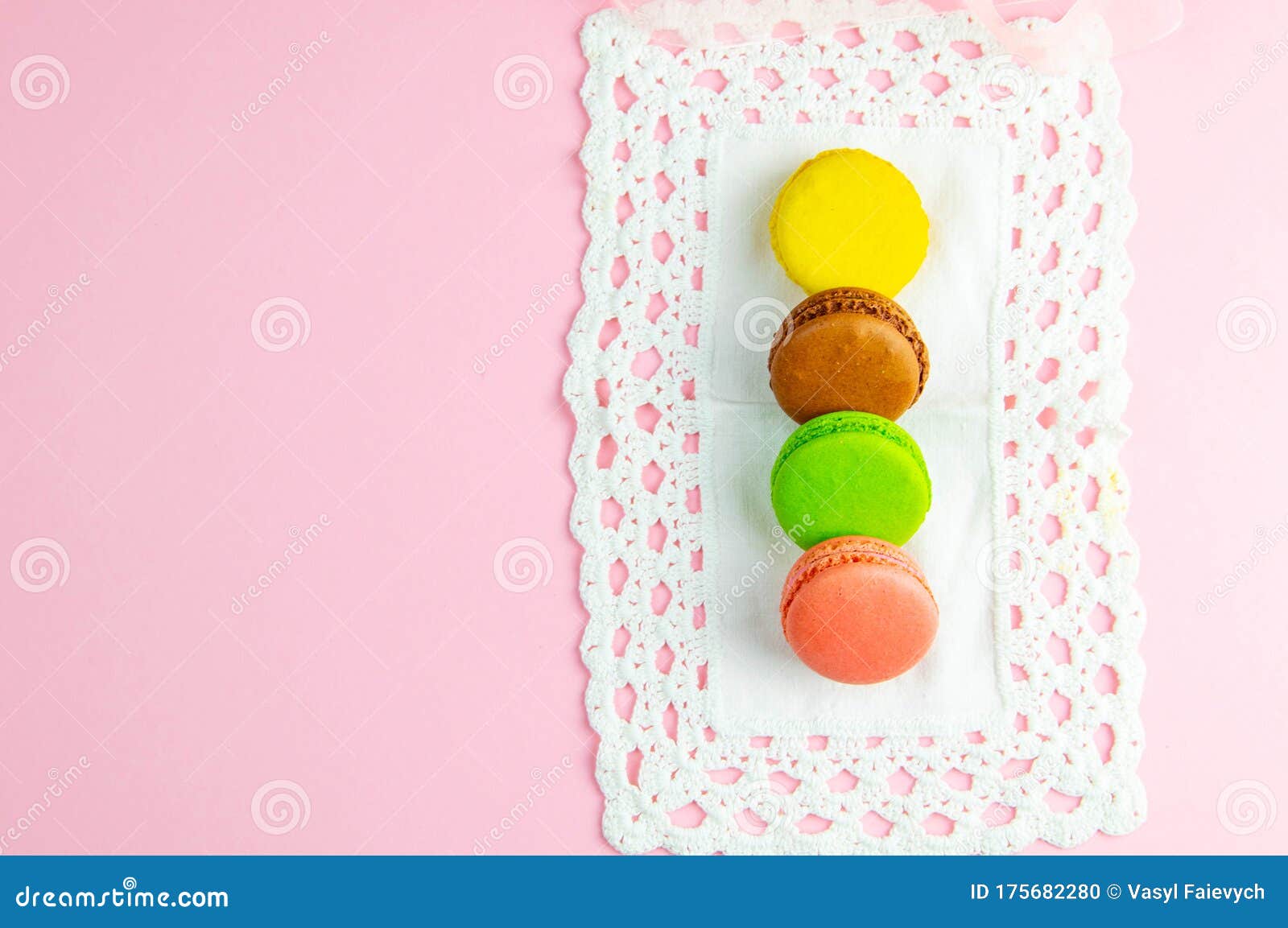 Several Multicolored Macaroons Pastel Colors on a White Napkin on Pink ...
