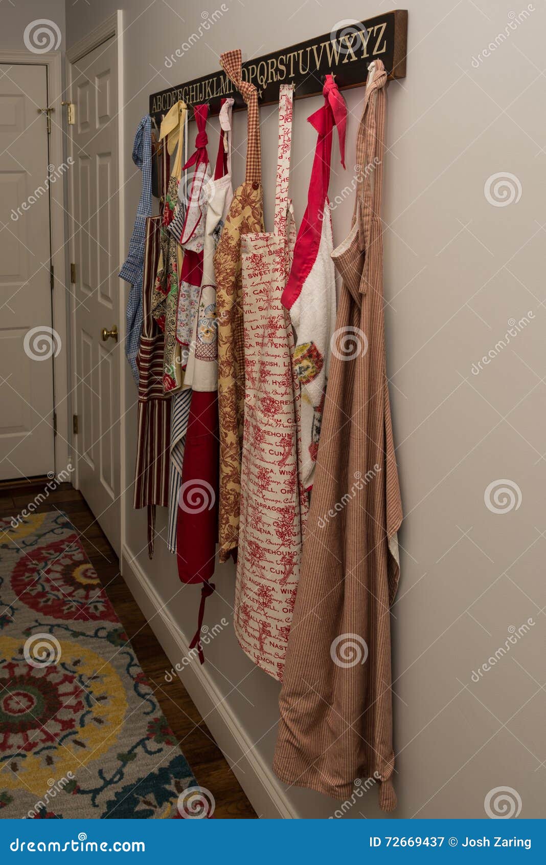 Several Old Aprons on Hooks Stock Image - Image of apparel, fashion ...
