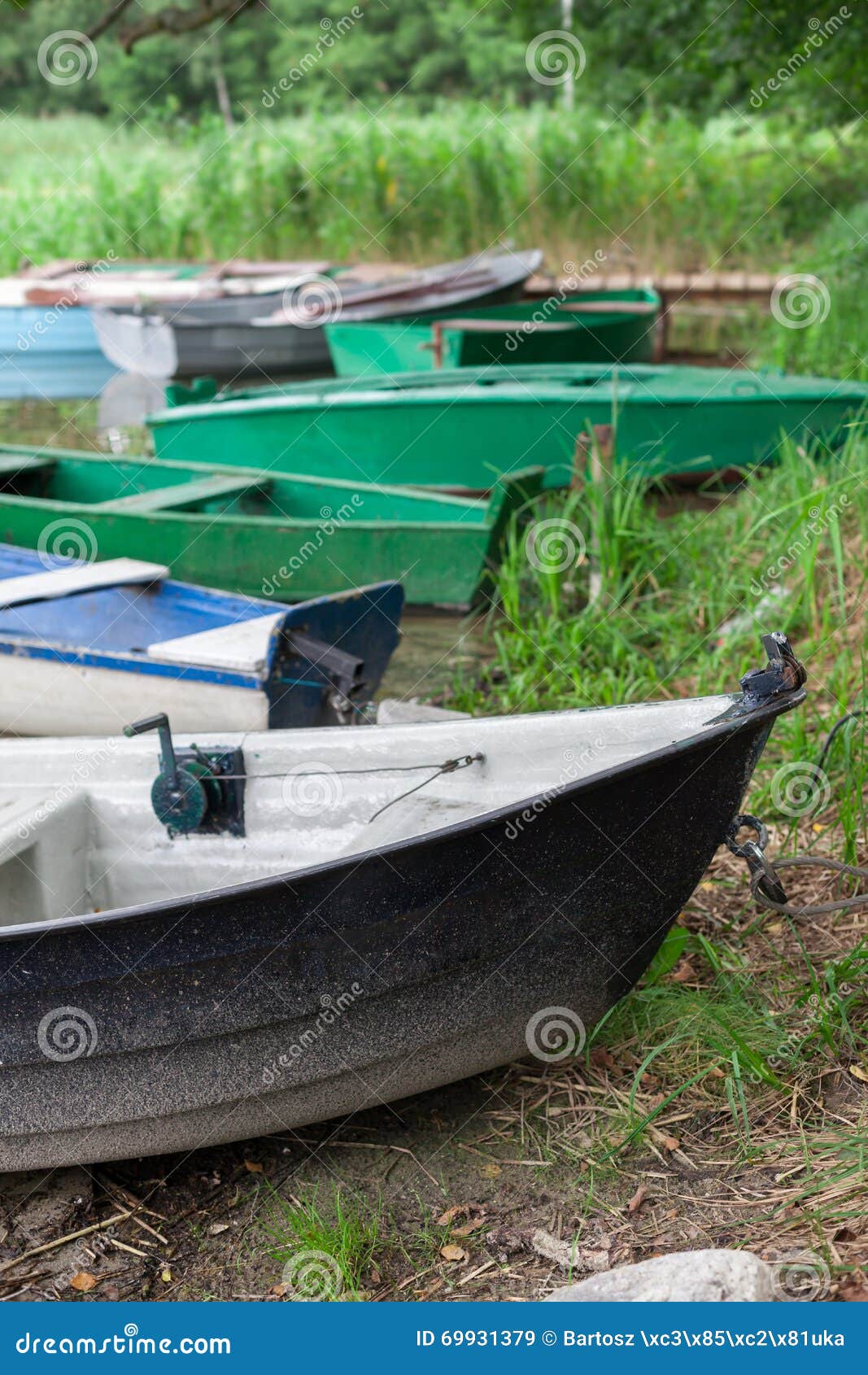 Several old rowing boats. stock image. Image of reed - 69931379