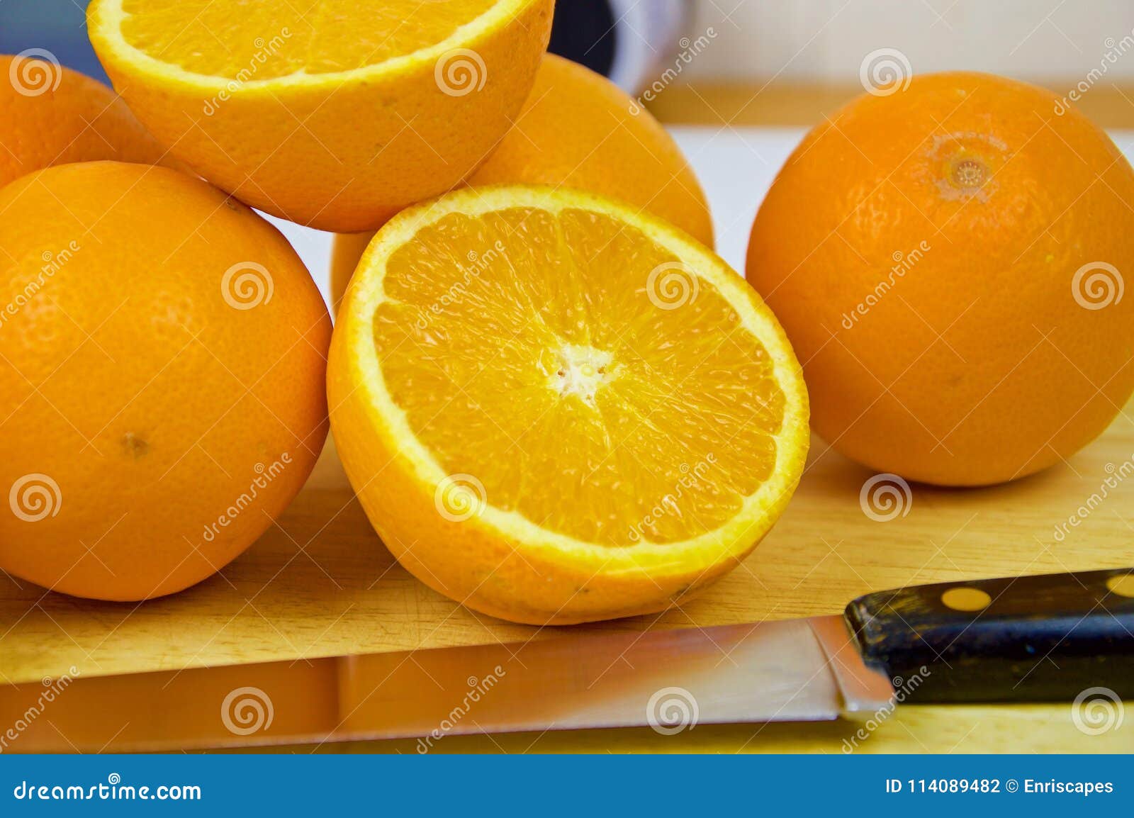 Several Oranges and One Cut in Half Stock Photo - Image of citrus ...