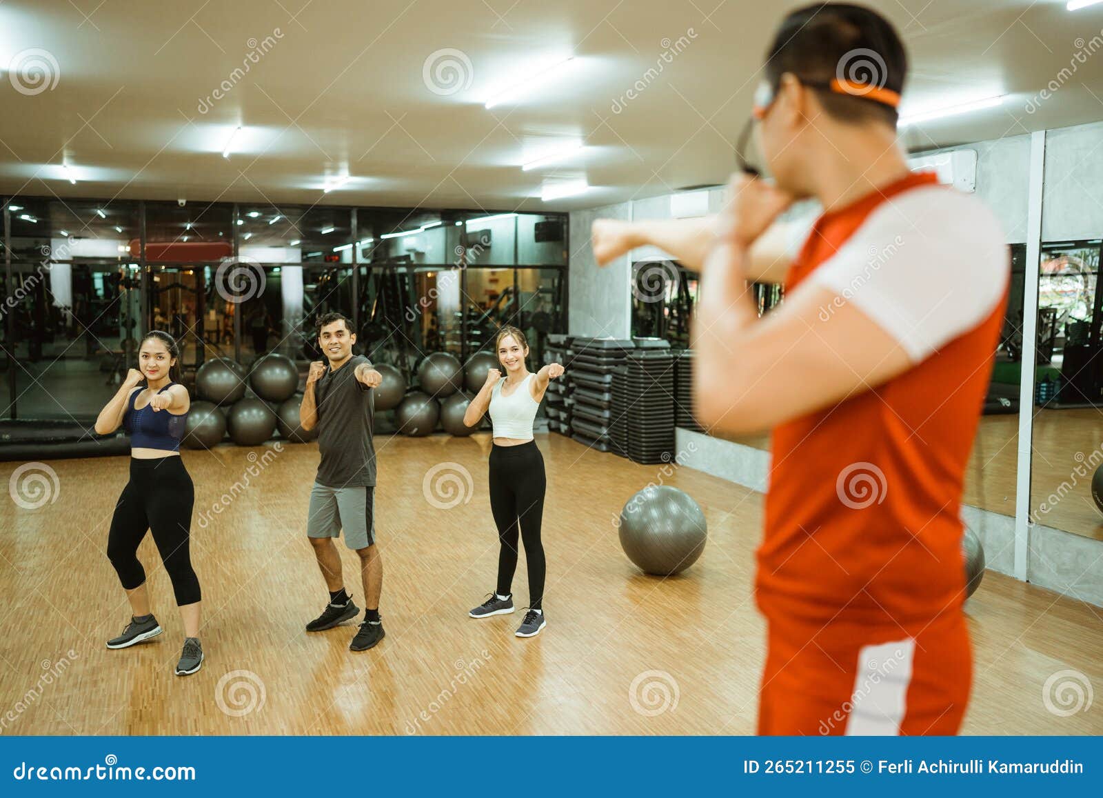 Several People Make Movements Led by a Male Instructor Stock Image ...