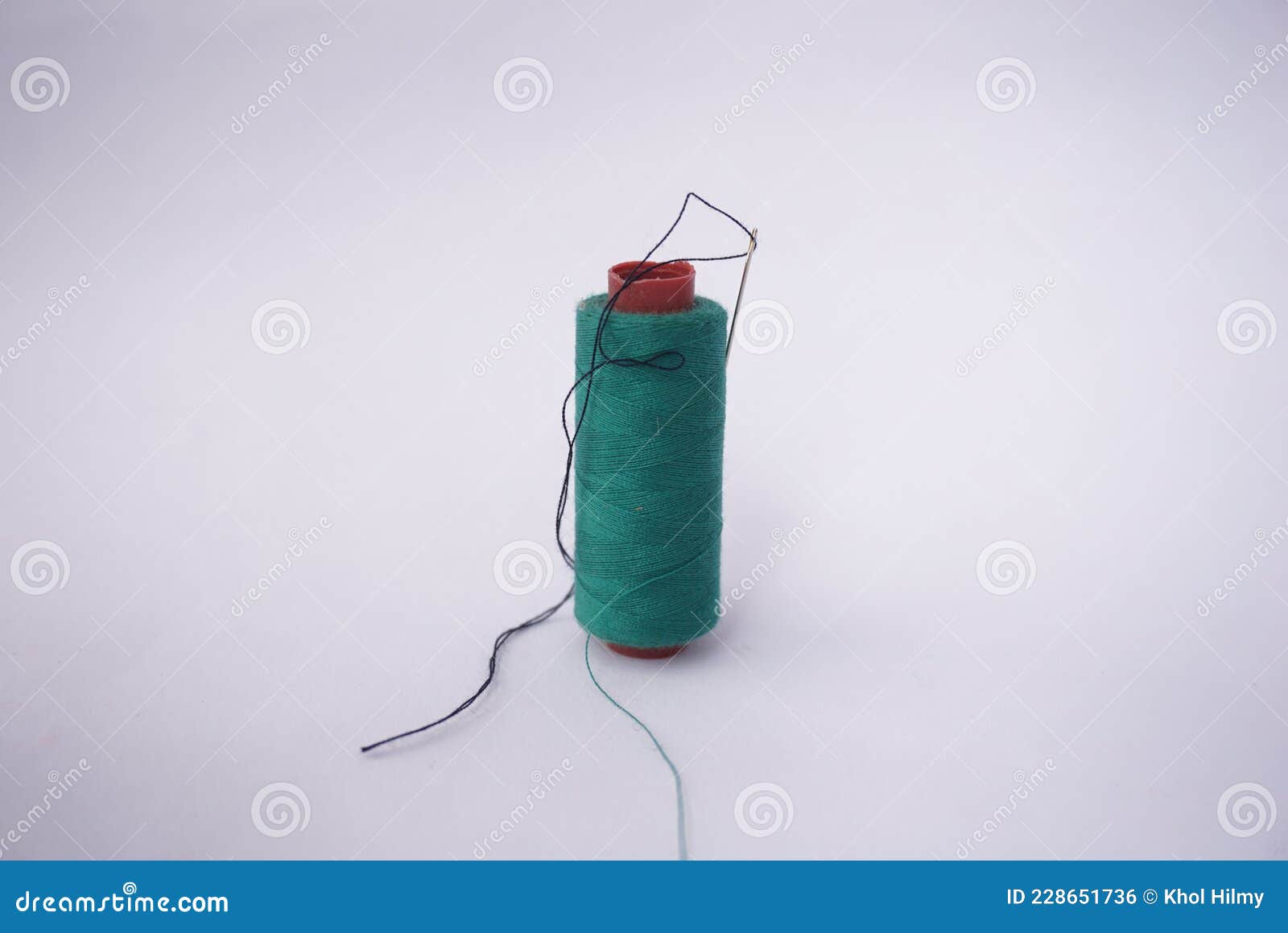 Several Piles of Sewing Thread Spools of Various Colors Isolated on a ...