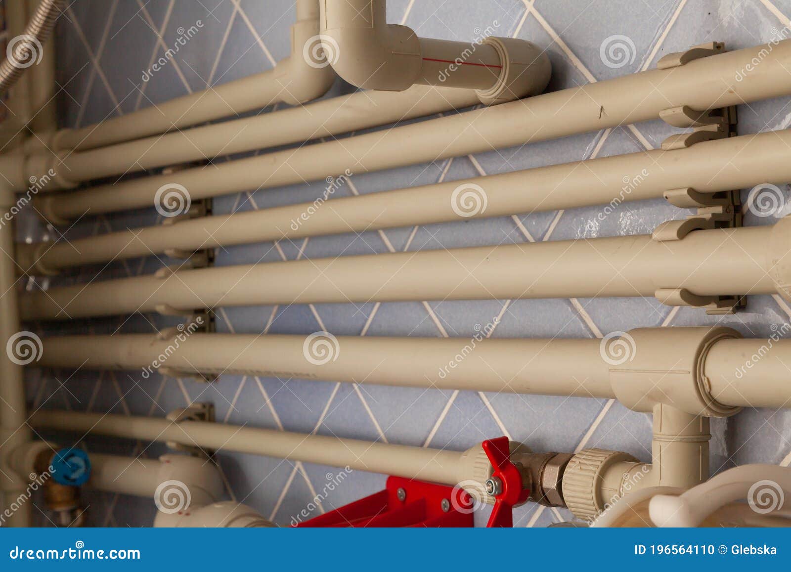 Several Plastic Pipes are Fixed To Wall in Parallel Stock Photo - Image ...
