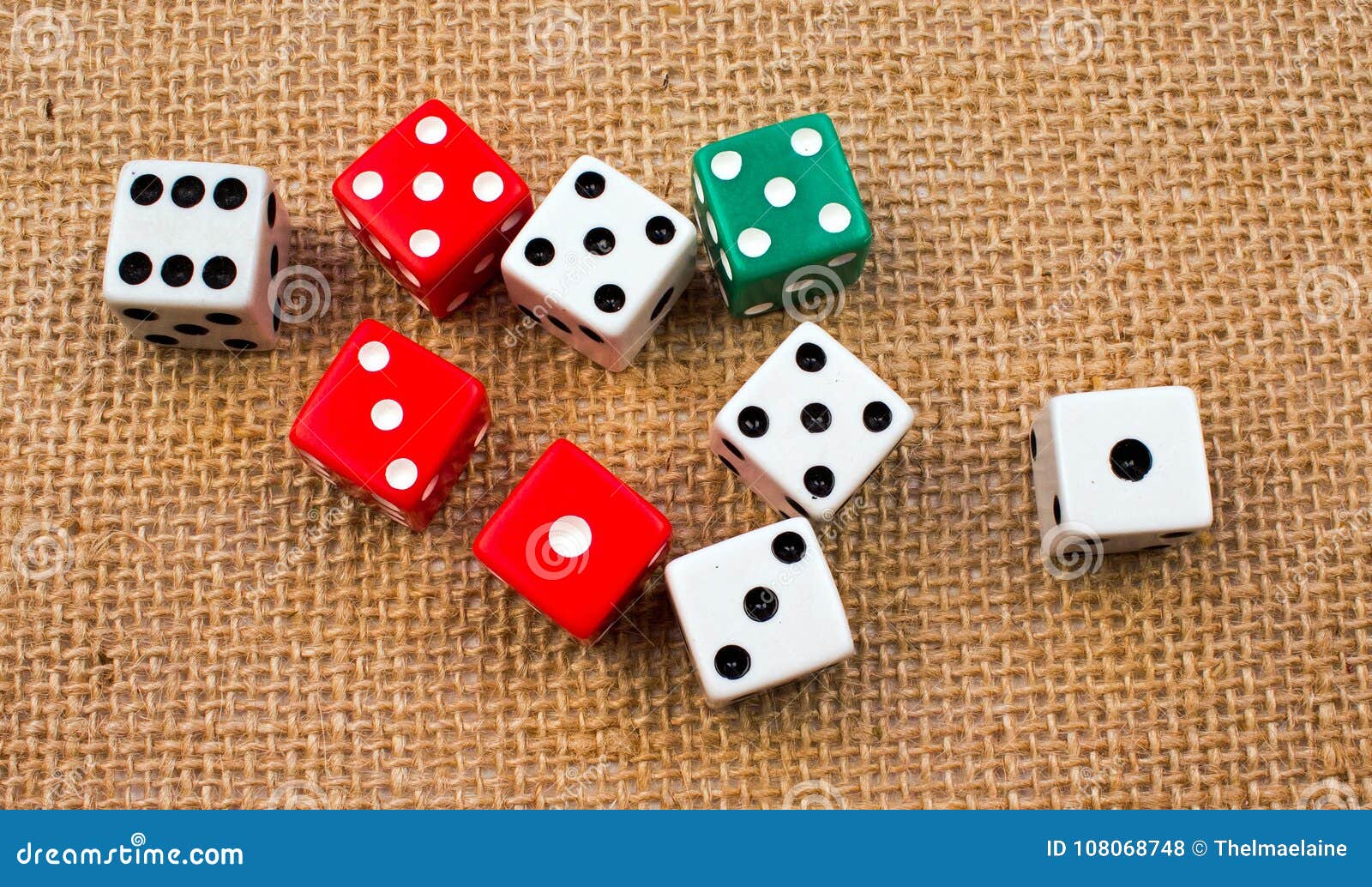 Several Random Dice Cubes on a Burlap Background Stock Photo - Image of ...