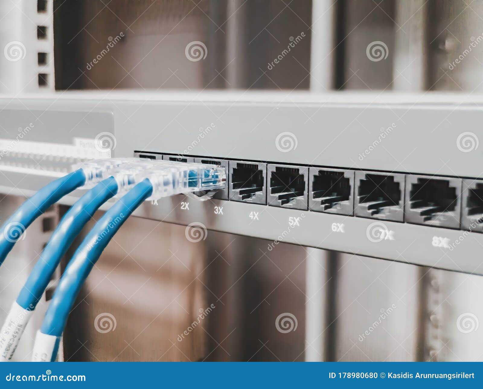 Several RJ45 Ethernet Cables Plugged into a Switch Inside a Server Rack ...