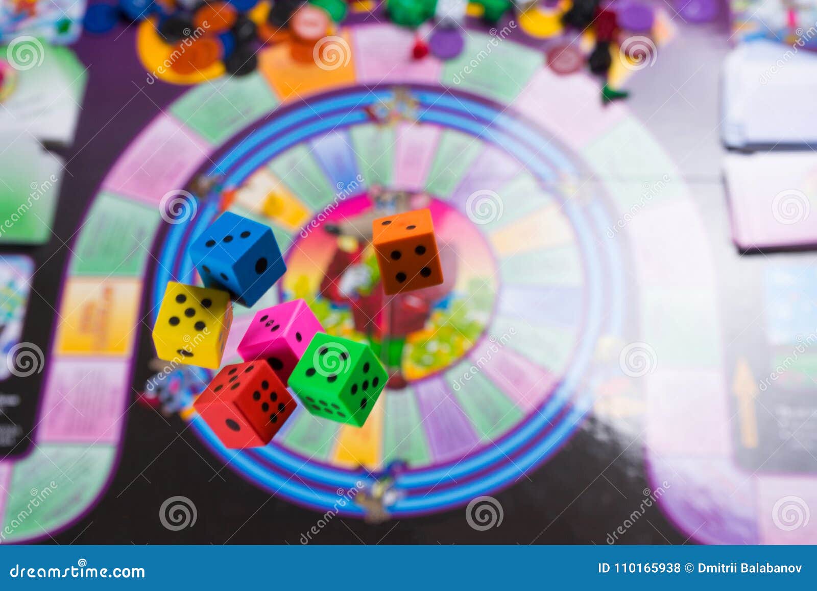 Several Rolling Color Dice Fall on a Table with Board Game. Gaming ...