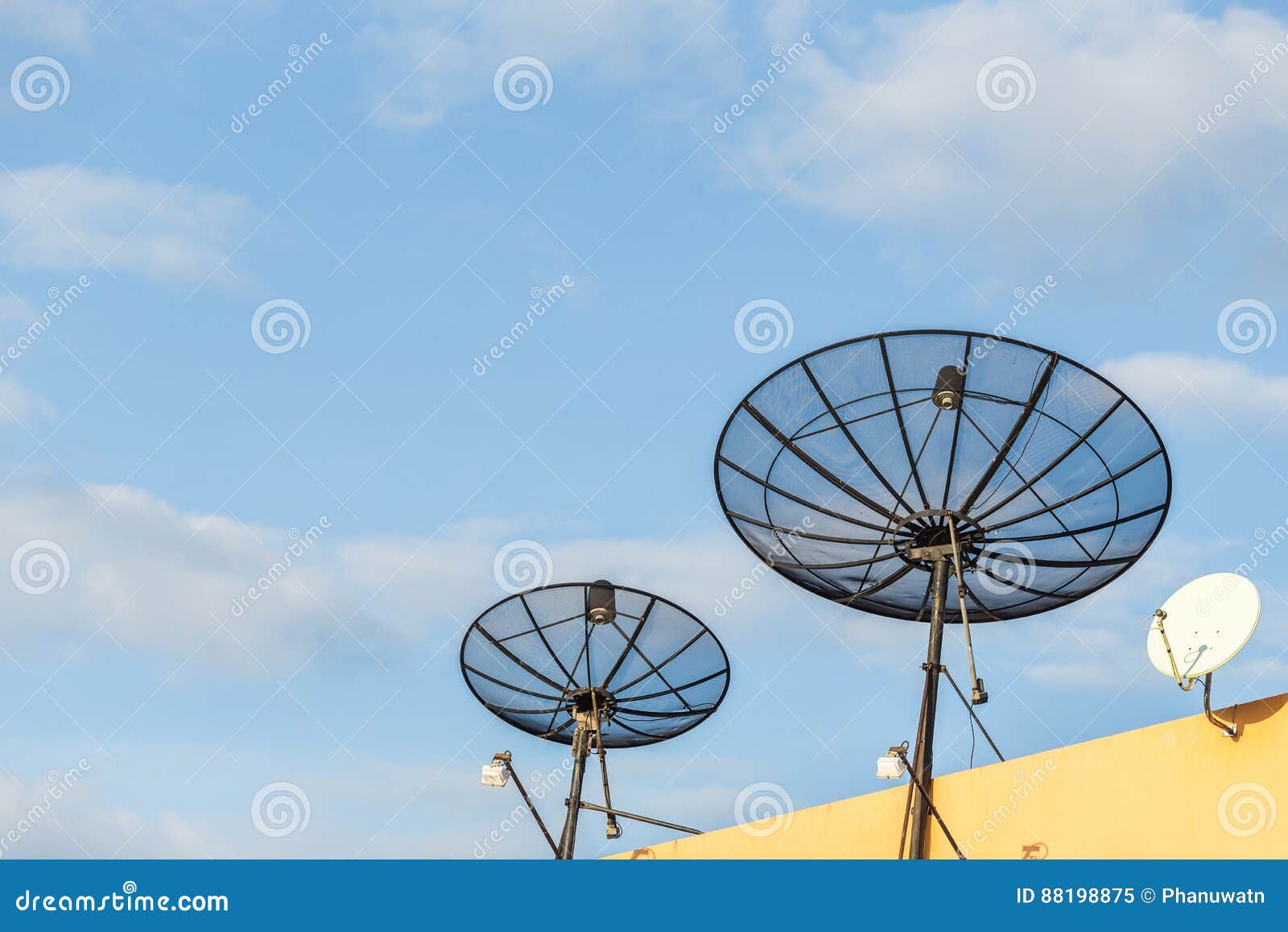Several Satellite Dish Installed on the House Roof with Blue Sky Stock ...