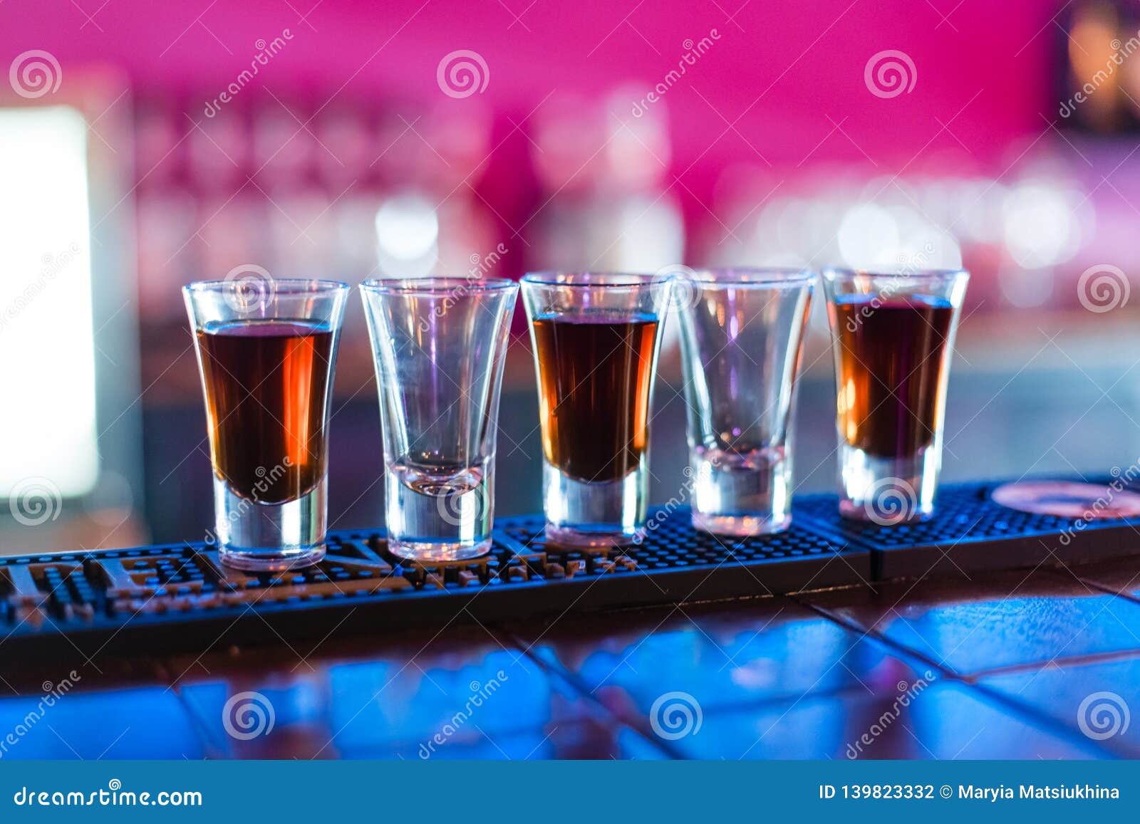 Several Shots of Different Drinks at a Party in a Nightclub. Stock ...
