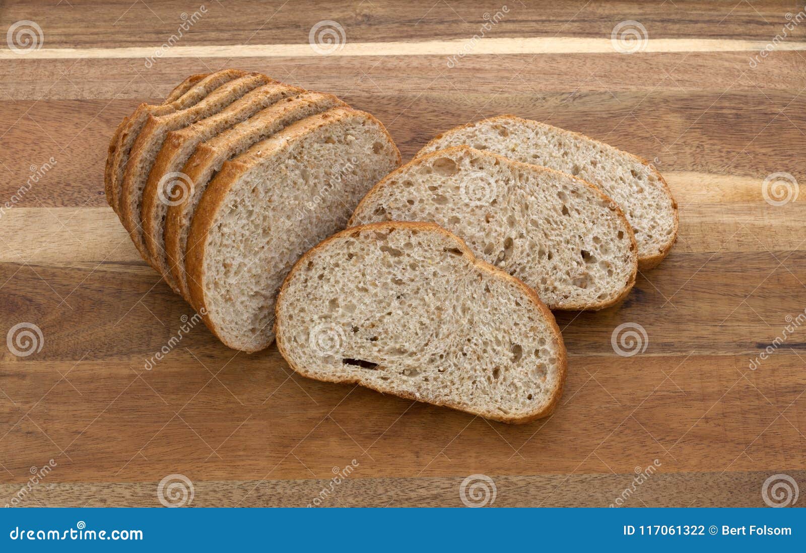 Slices in Front of a Small Bread Loaf Stock Photo - Image of table ...