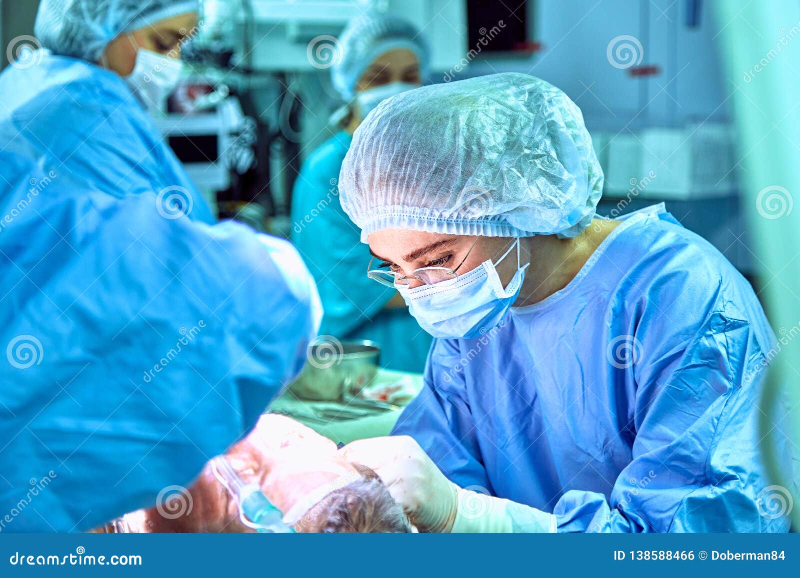 Several Surgeons Surrounding Patient on Operation Table during Their ...