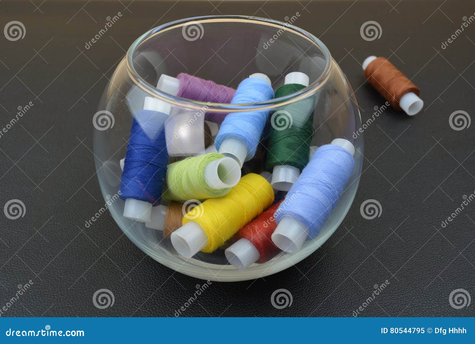 Several Threads in Plastic or Glass Cup. Threads Collection in Glass ...