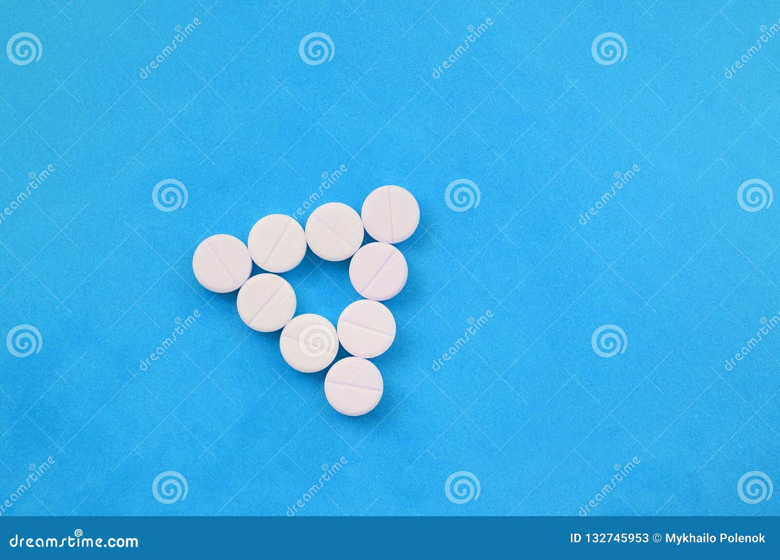 Several White Tablets Lie on a Bright Blue Background in the Form of an ...
