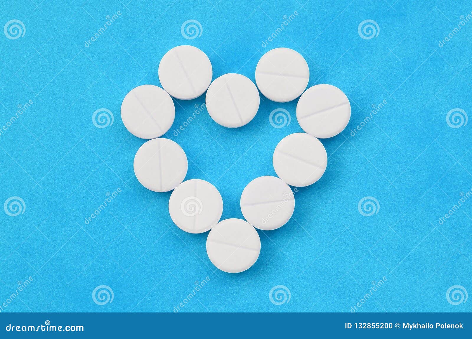 Several White Tablets Lie on a Bright Blue Background in the Shape of a ...