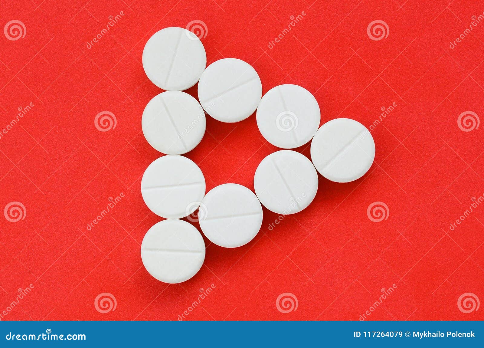Several White Tablets Lie on a Bright Red Background in the Form of an ...