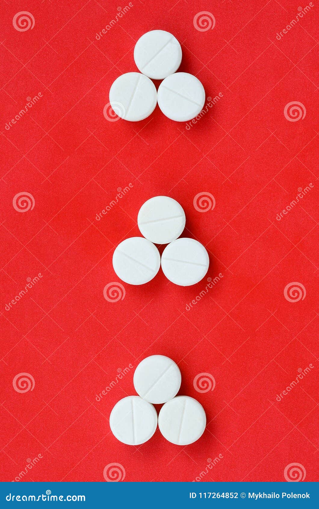 Several White Tablets Lie on a Bright Red Background in the Form of ...