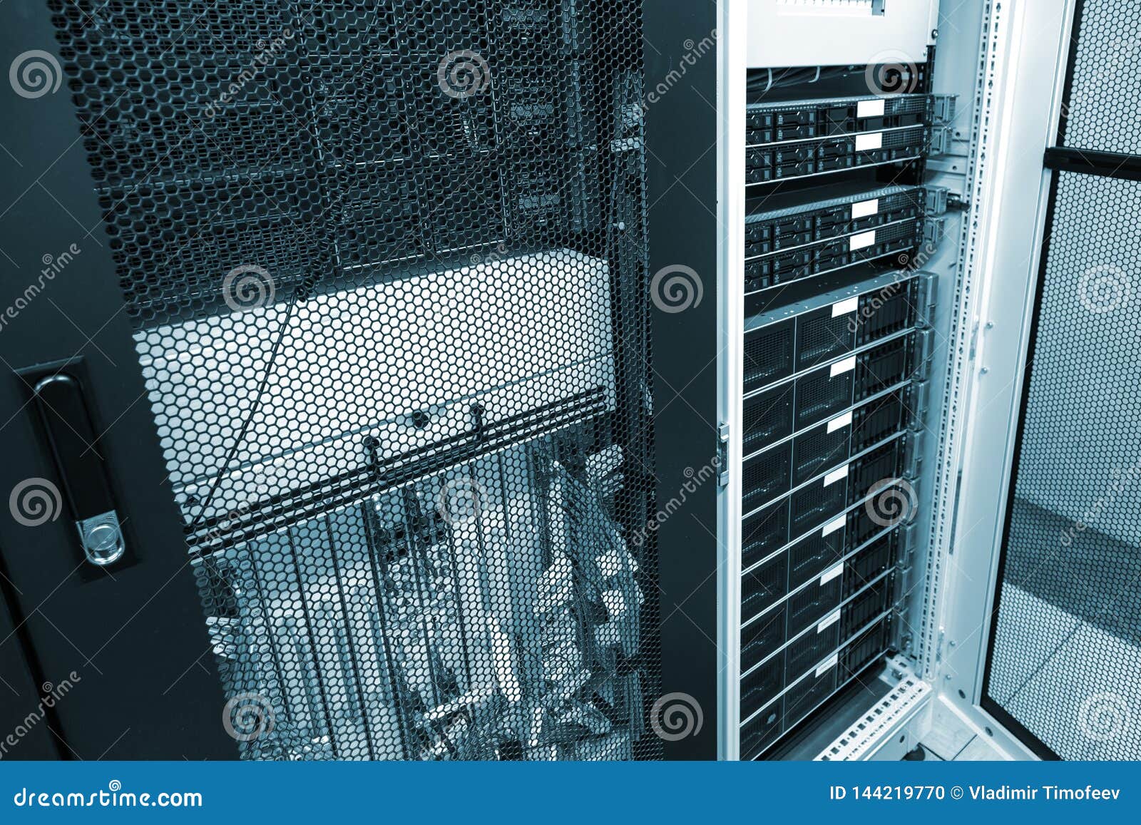 Severs Computer in Rack at Big Data Center Under Grid Door with Green ...