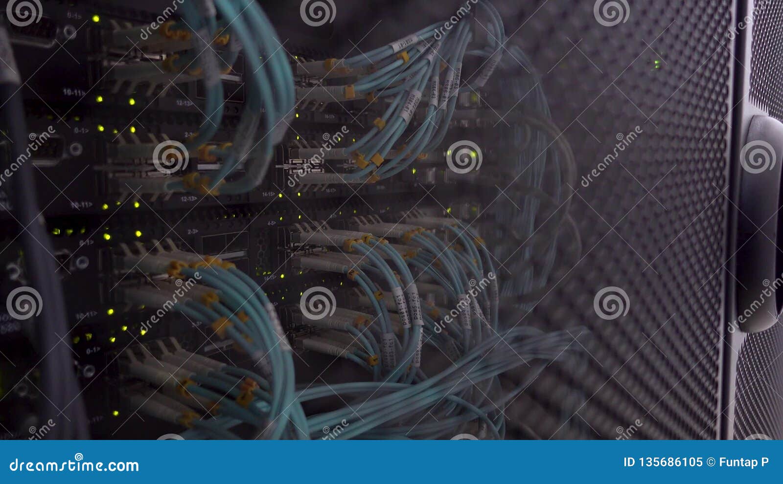 Severs Computer in a Rack at the Large Data Center. Optical Fiber Cable ...
