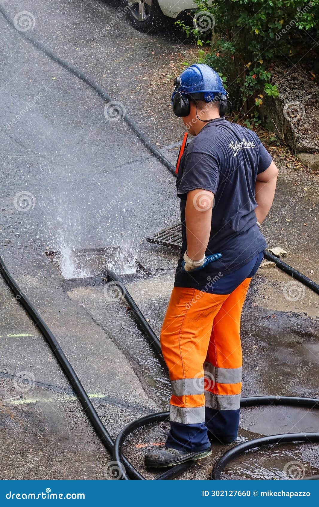 Sewer Cleaning and Worker with Water and Hose in Pipe Editorial Image ...